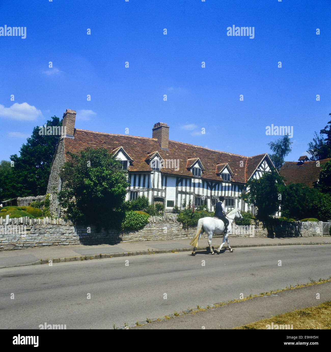 A female horse rider passing Mary Ardens cottage, Mary Ardens Farm ...