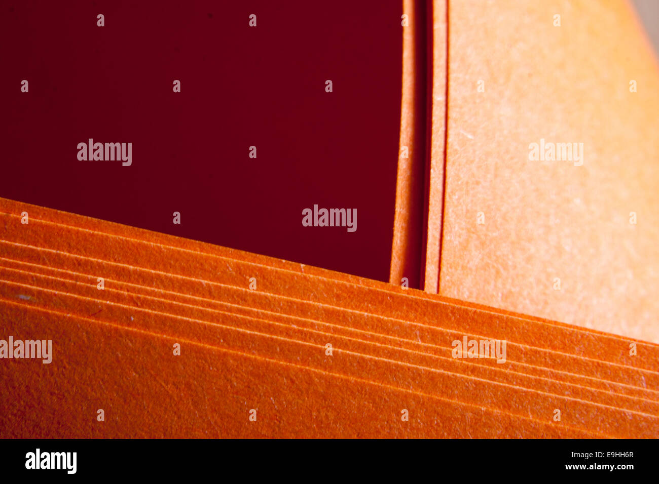 Grungy orange paper folds Stock Photo - Alamy