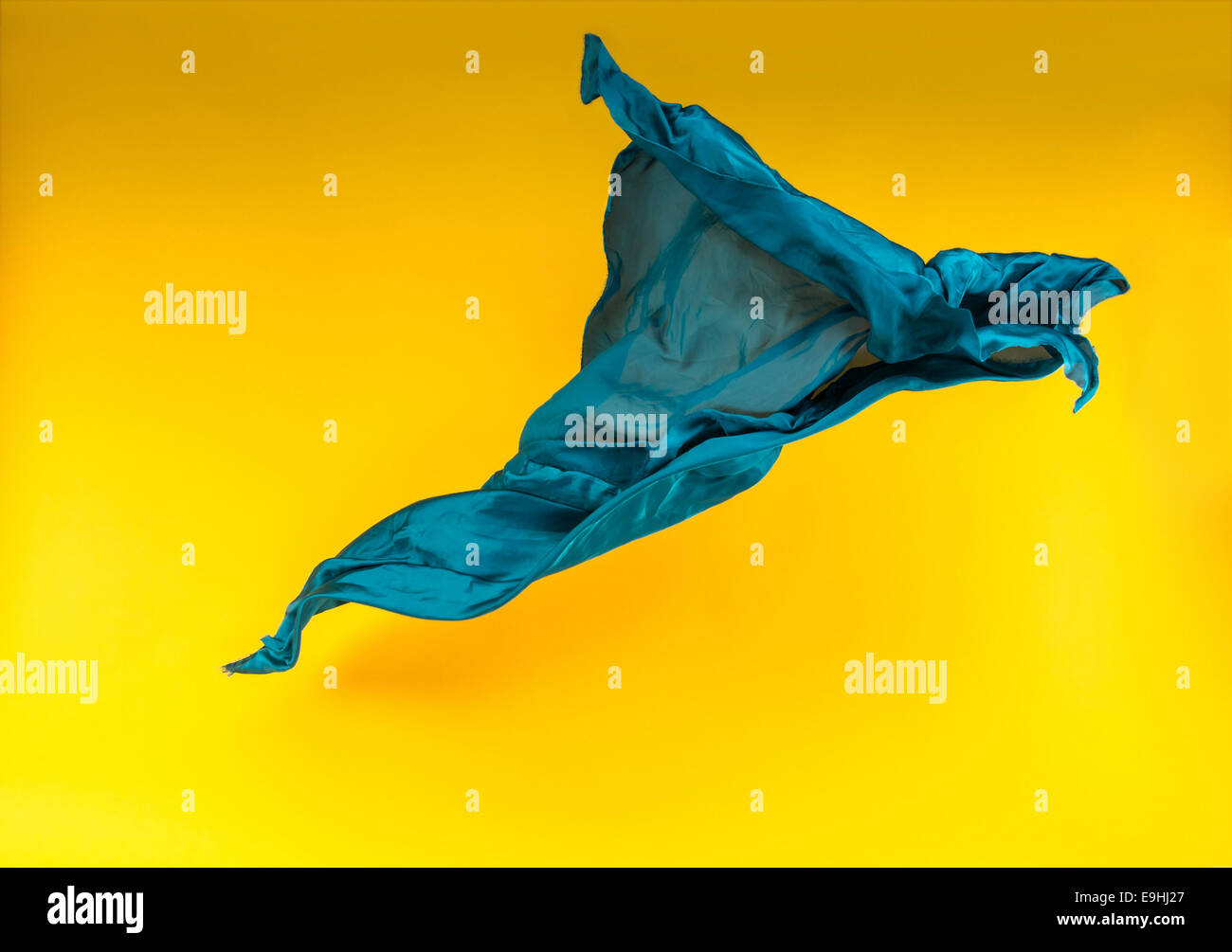 blue fabric over yellow background Stock Photo - Alamy