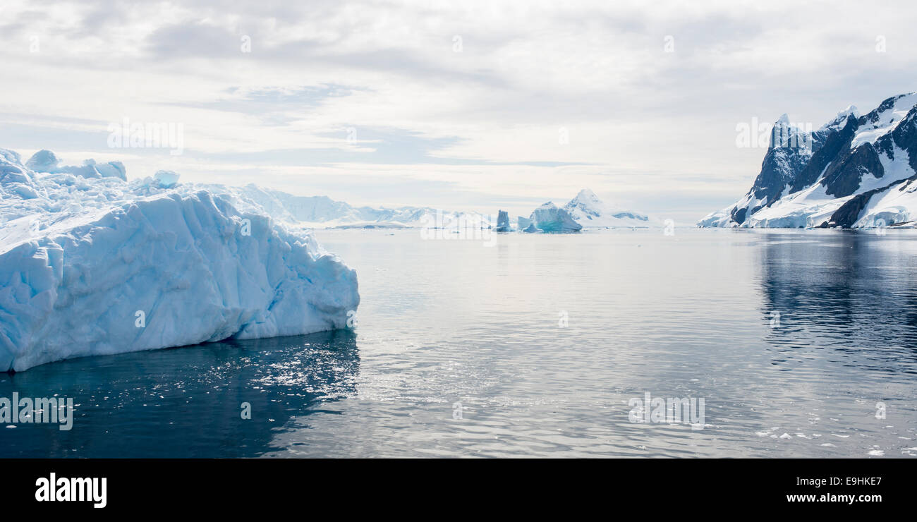 iceberg and rocky cliffs, Antarctica Stock Photo - Alamy