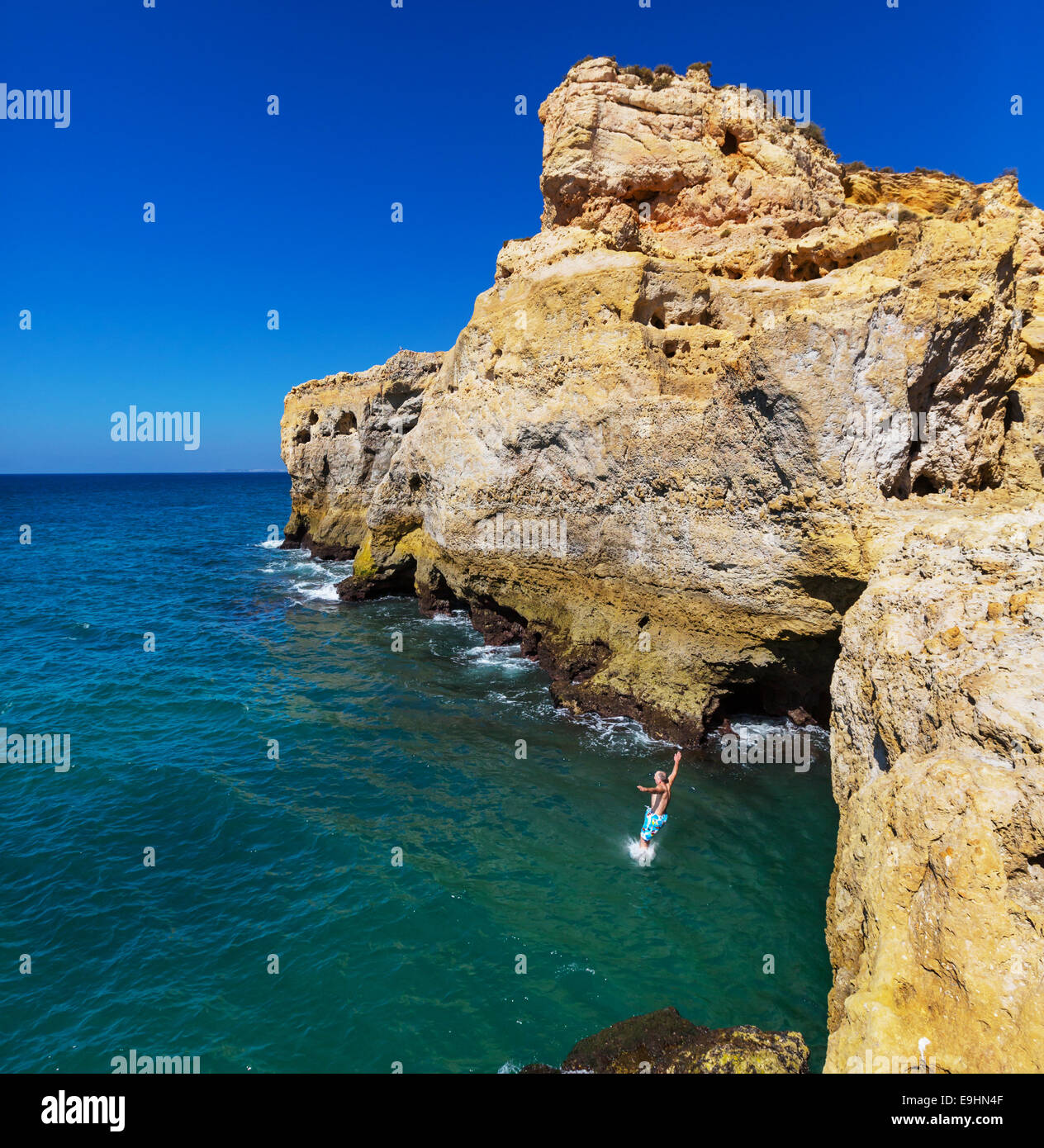 Jumping in water Stock Photo - Alamy