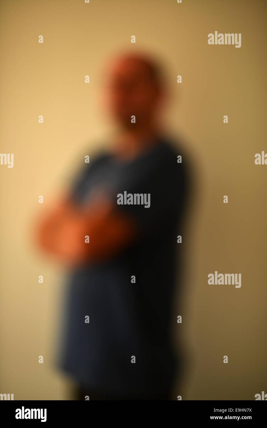 An anonymous man blurred by soft focus Stock Photo - Alamy