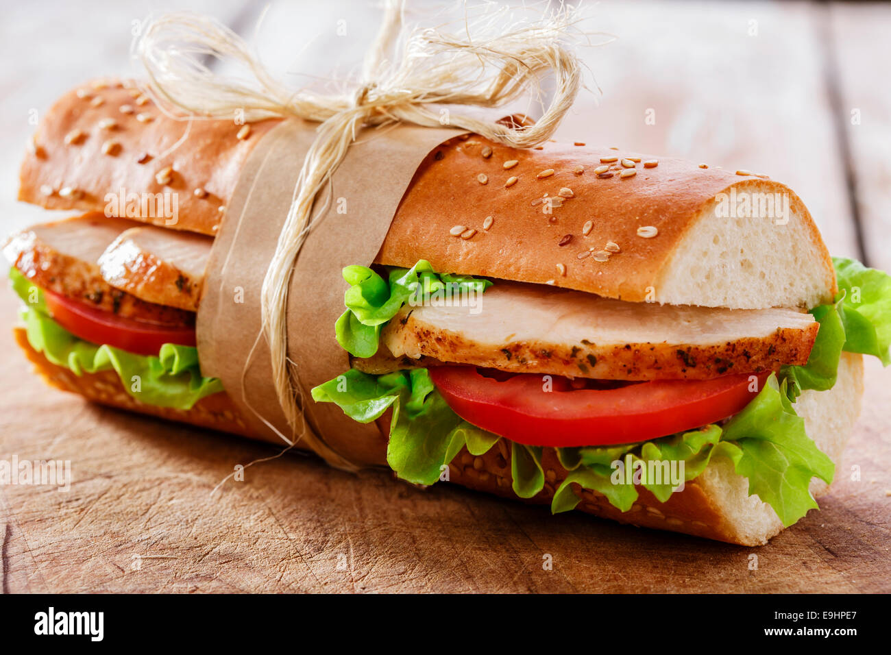 baguette sandwich with grilled chicken and tomatoes Stock Photo - Alamy