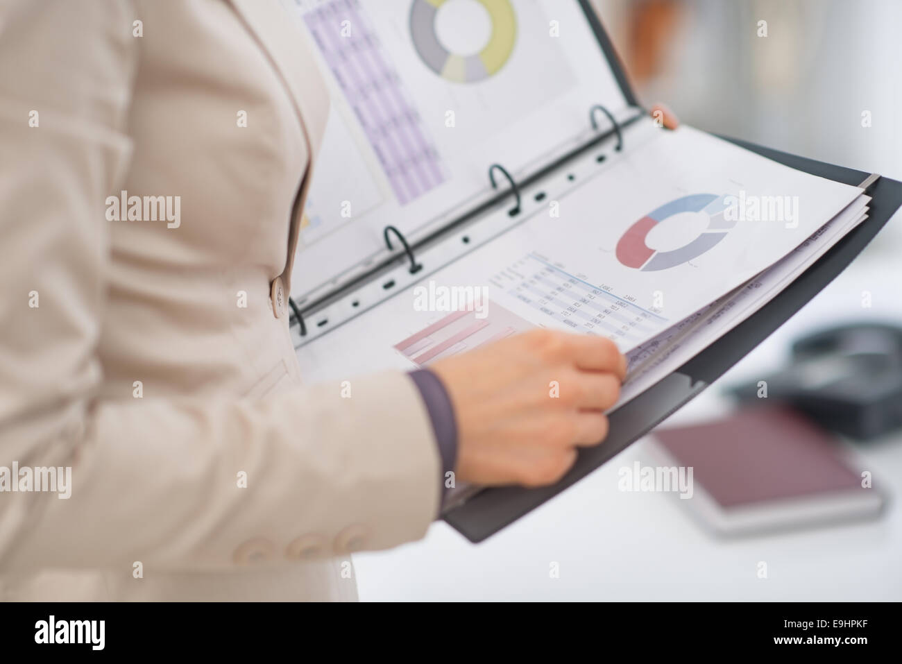 Closeup on business woman working with documents Stock Photo - Alamy
