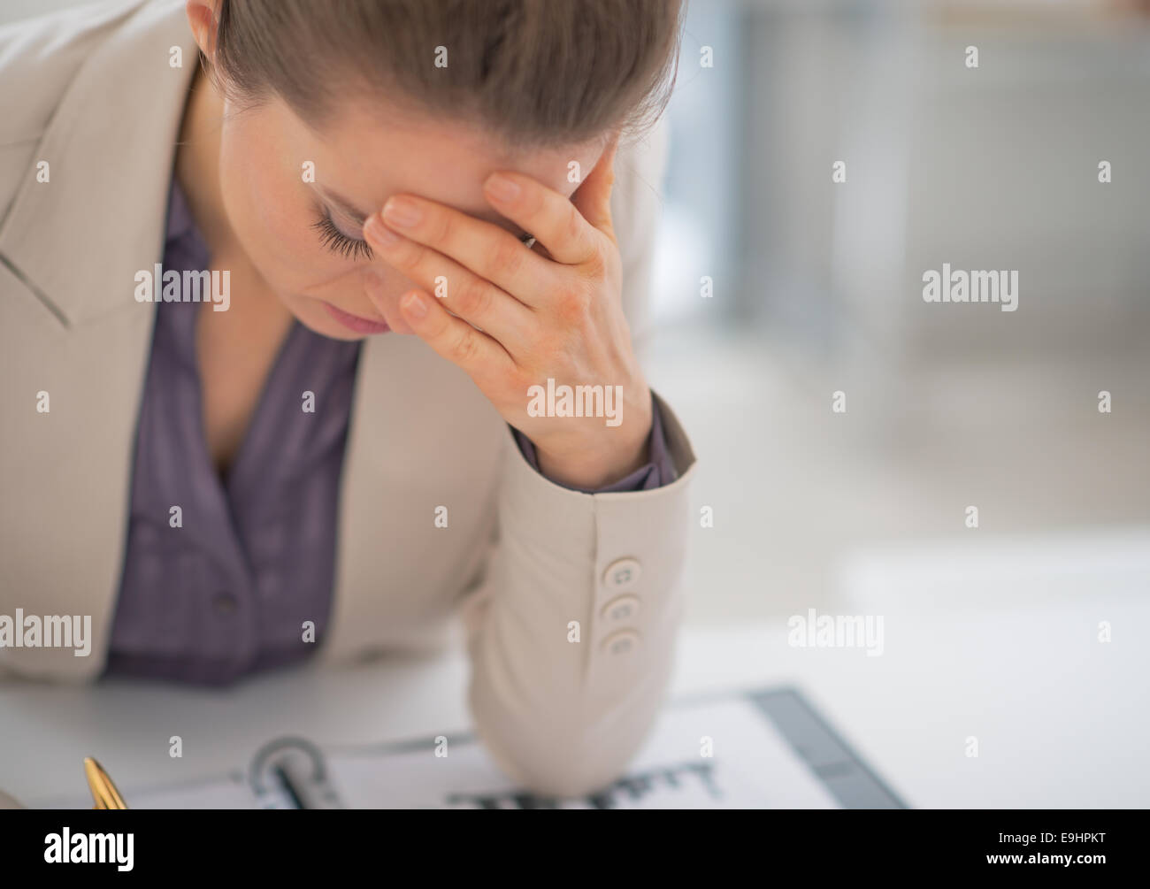 Portrait of stressed business woman in office Stock Photo - Alamy