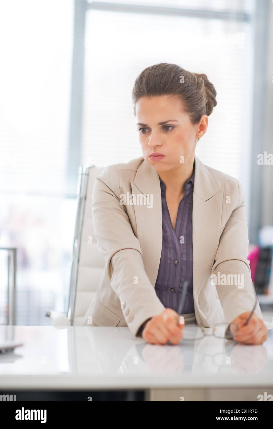 Portrait of concerned business woman with eyeglasses in office Stock ...