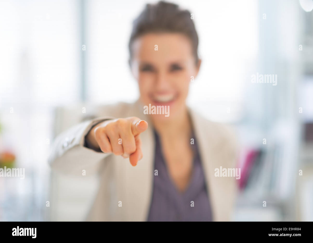Closeup on happy business woman pointing in camera Stock Photo - Alamy