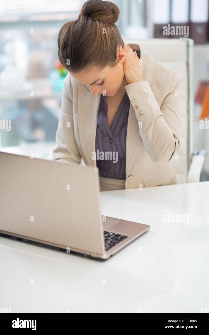 Portrait of tired business woman in office Stock Photo - Alamy