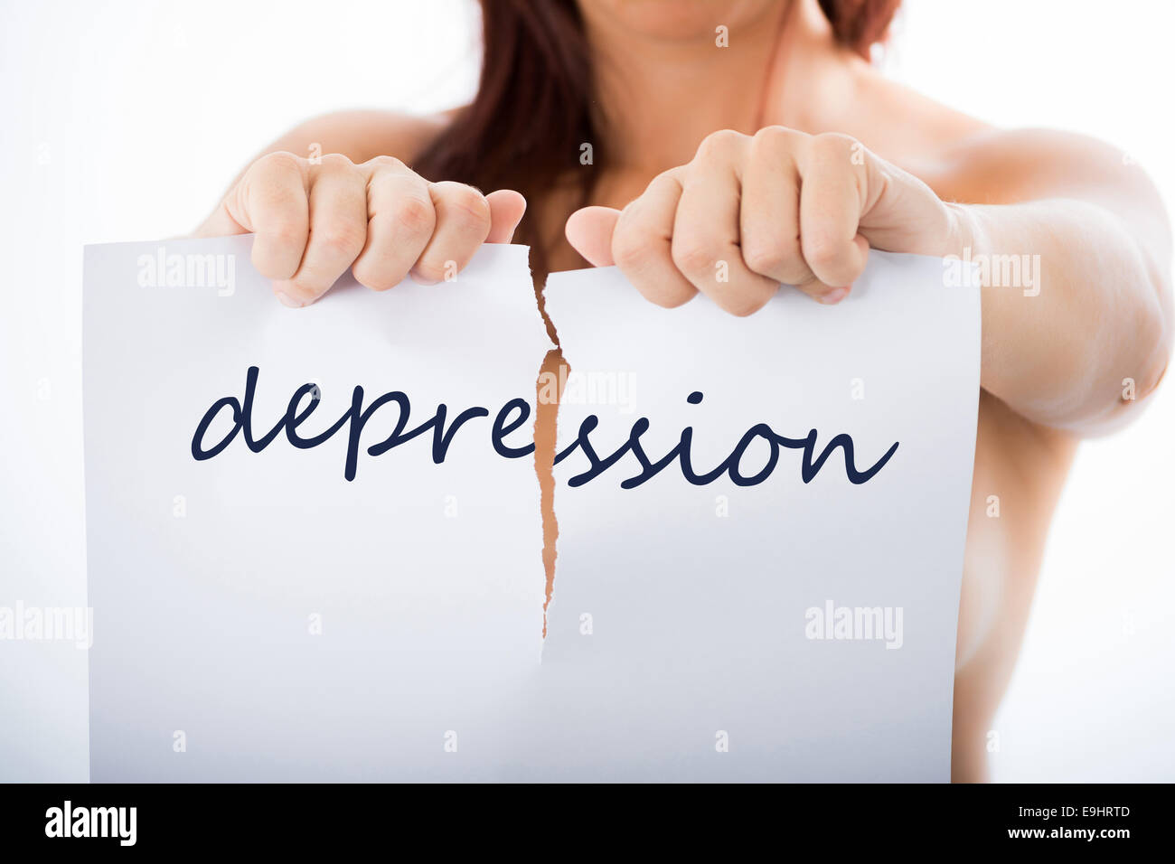 woman tearing sheet of paper with the word depression Stock Photo - Alamy