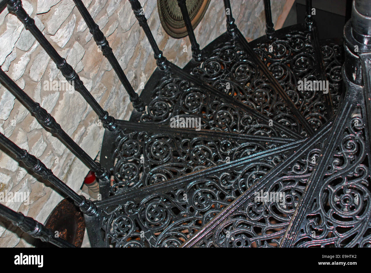 Black metal ornate spiral staircase in an old country cottage Stock ...