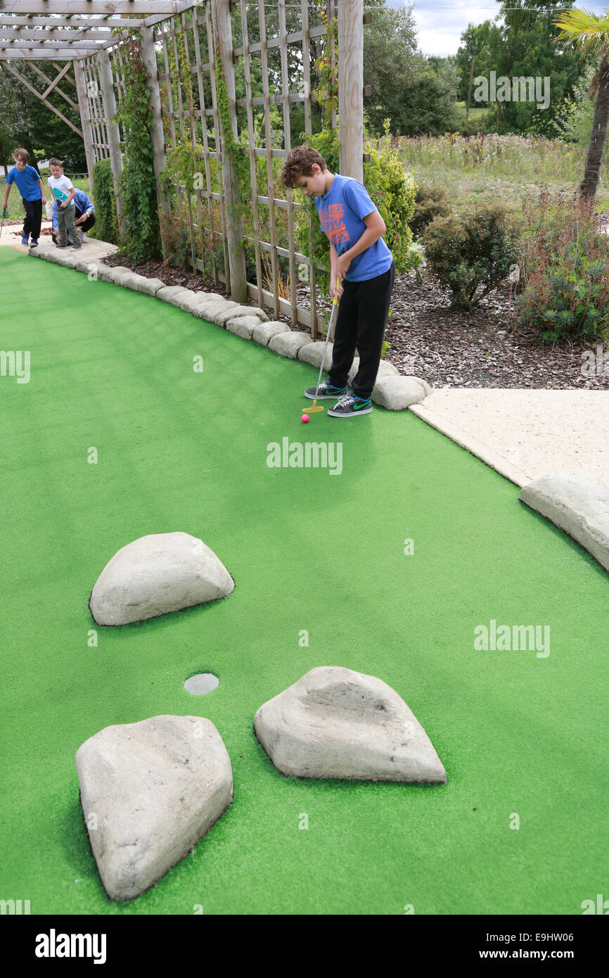 Children playing crazy golf Stock Photo - Alamy