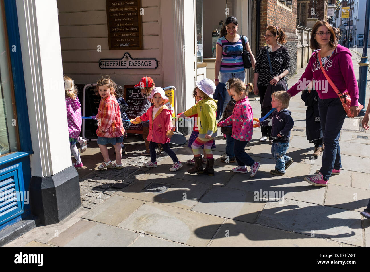 Nursery school children walk along the pavement in a 'crocodile ...