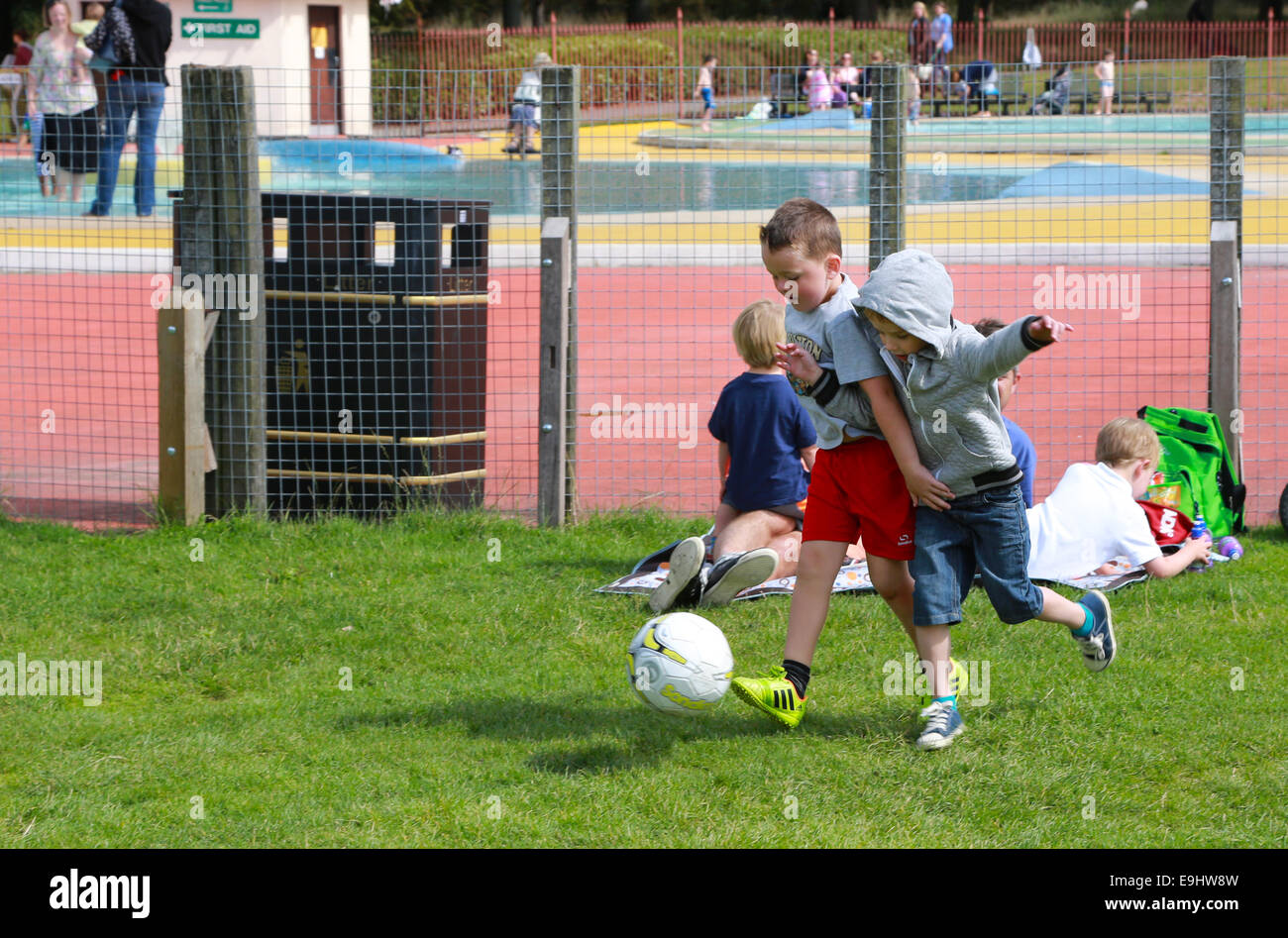 Children playing football Stock Photo - Alamy