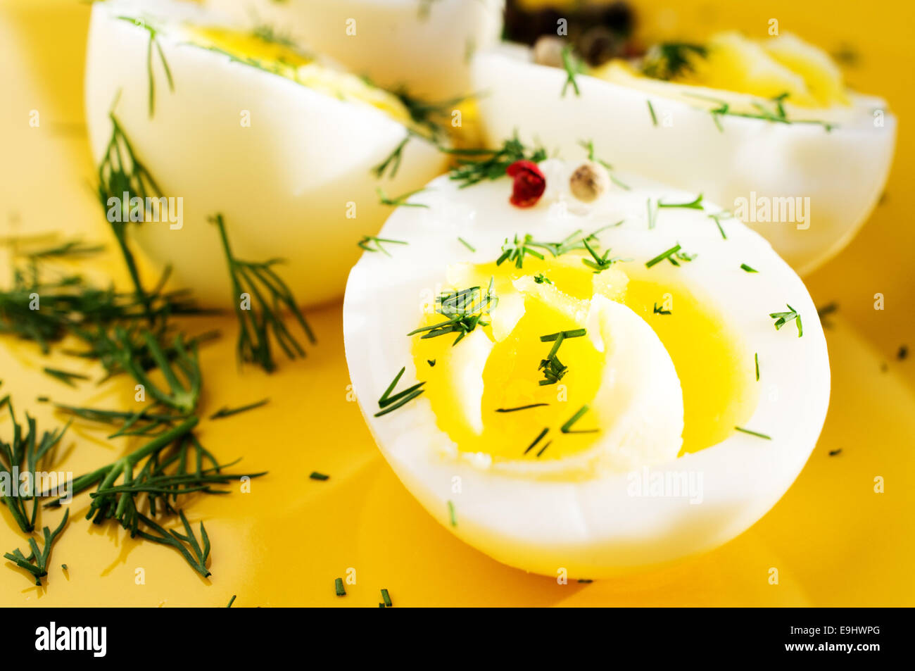 Boiled eggs with salt, pepper and dill Stock Photo - Alamy