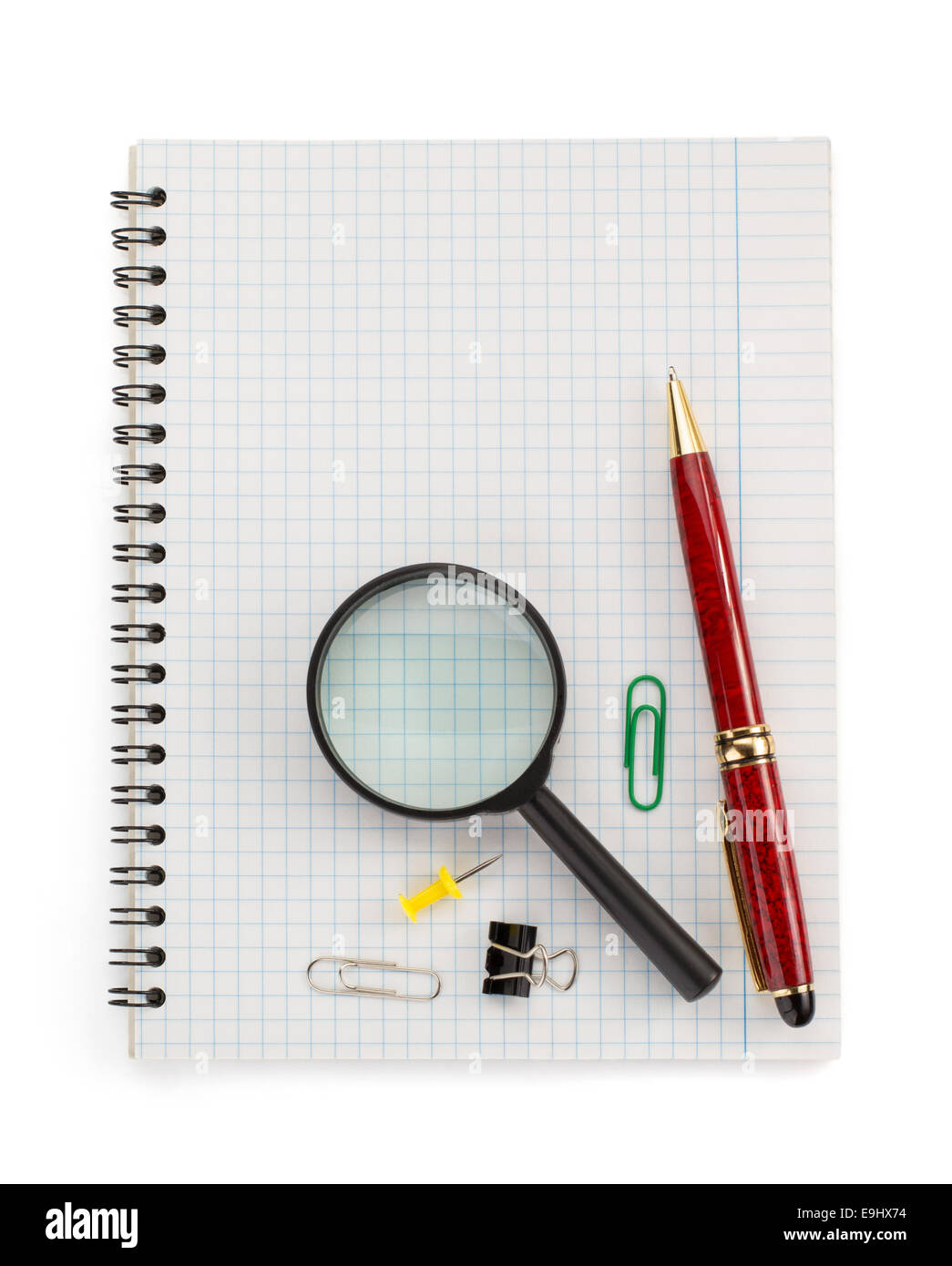 checked notebook isolated on white background Stock Photo - Alamy