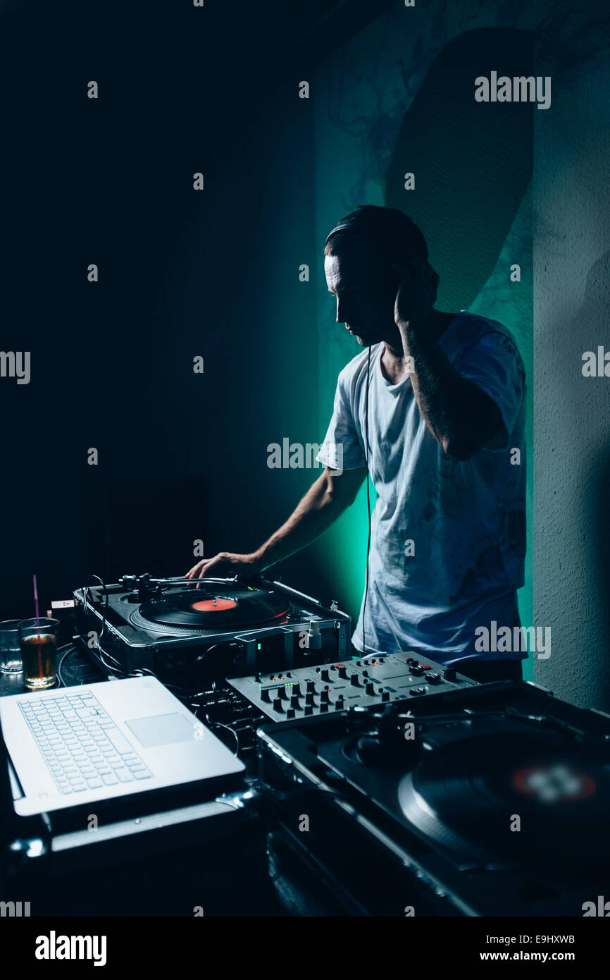 Silhouette of dj at work in night club. Shallow depth of field Stock ...