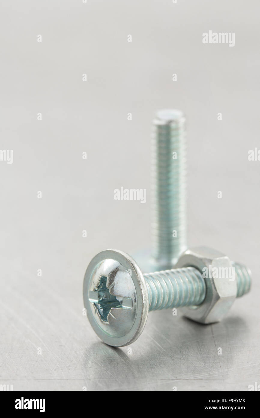 bolts tool at metal background texture Stock Photo - Alamy