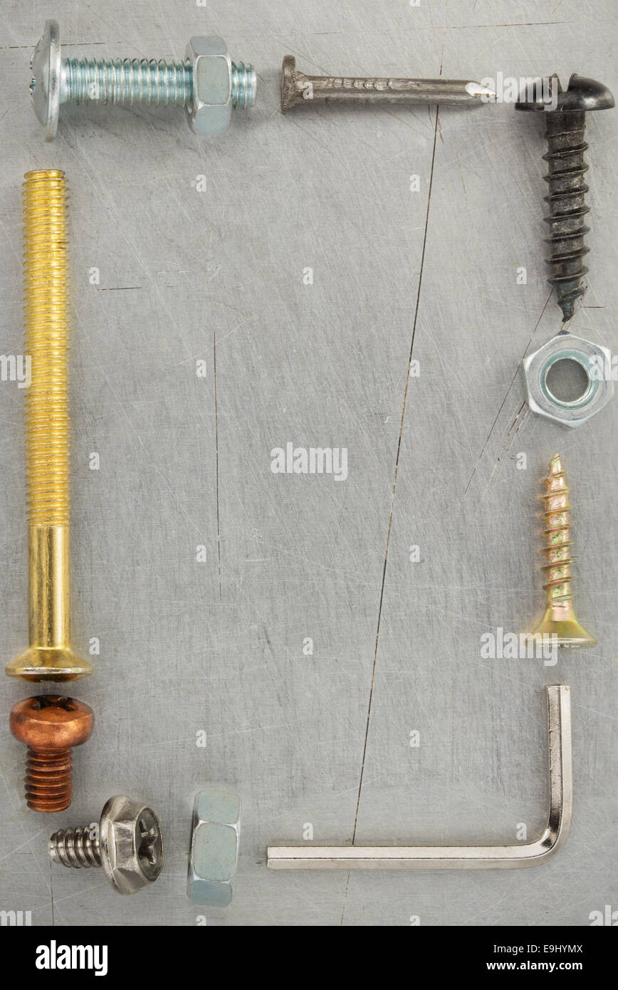 bolts and nuts tool at metal background texture Stock Photo - Alamy