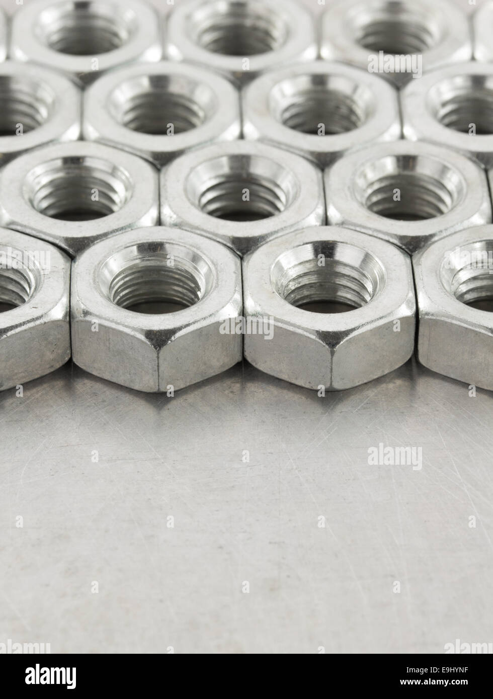 nuts tool at metal background texture Stock Photo - Alamy