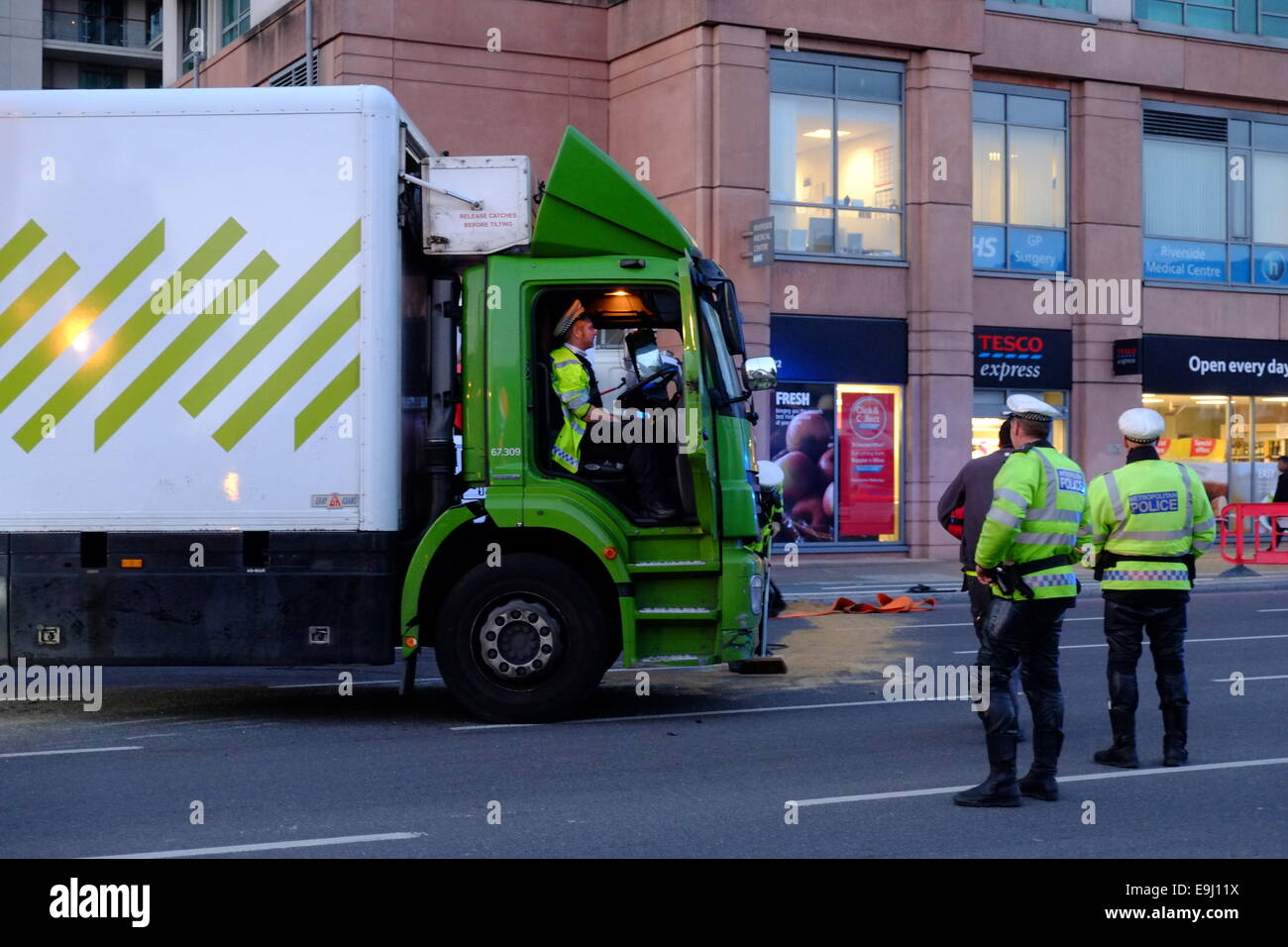 London, UK. 28th October, 2014. A Waitrose lorry which tipped on its ...