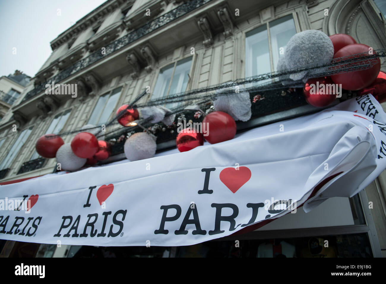 a shop front store display sign with i heart paris sign on a building ...