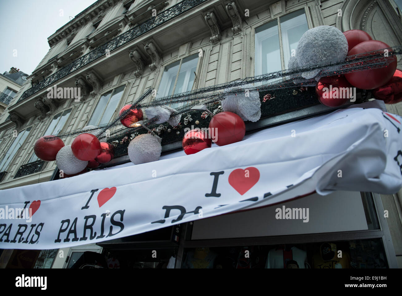 a shop front store display sign with i heart paris sign on a building ...