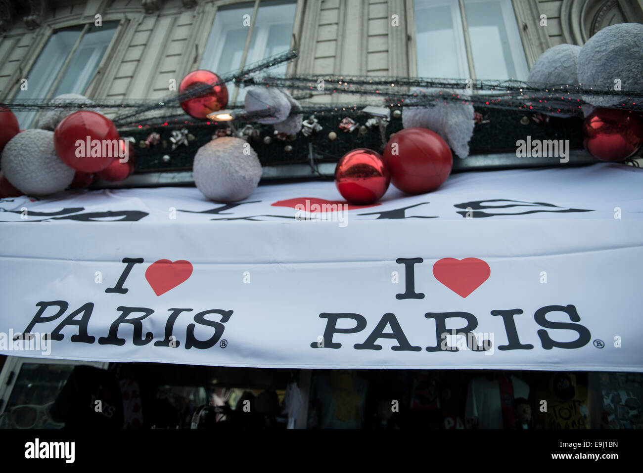 a shop front store display sign with i heart paris sign on a building ...