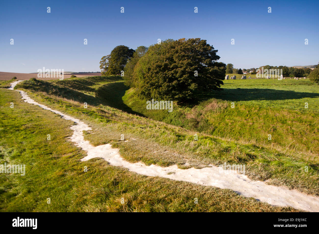 UK, England, Wiltshire, Avebury, stone circle, worn footpath along bank ...