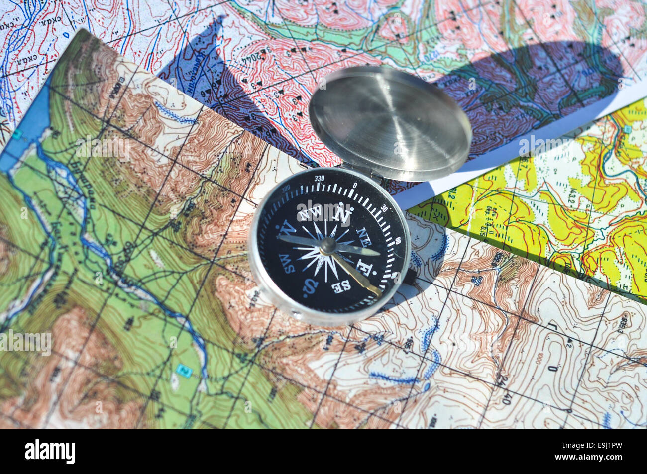 The compass on the map. Open the compass lies on topographic maps and ...