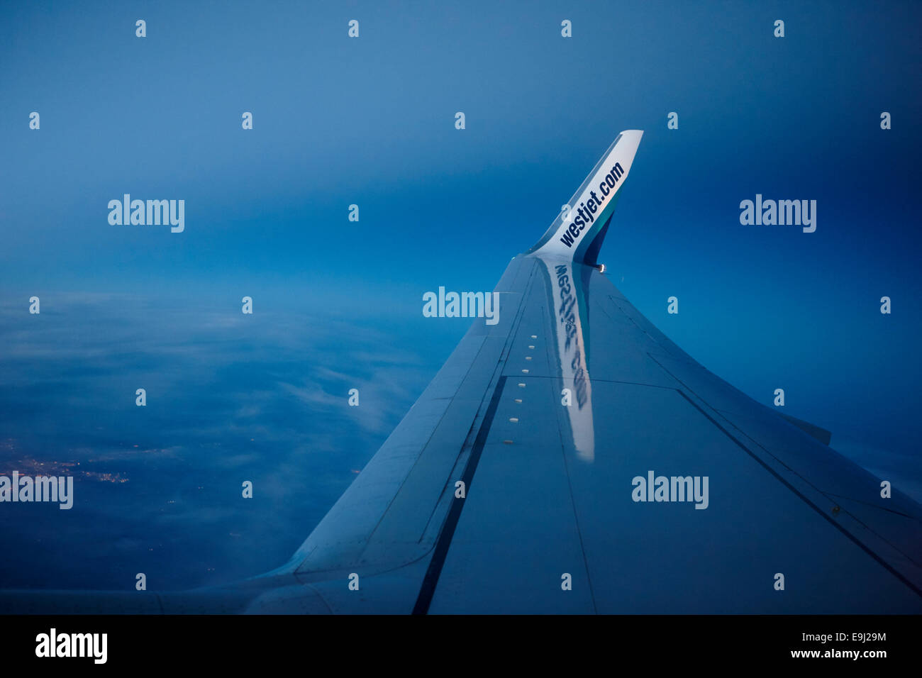 winglet on a boeing 737-800 westjet aircraft flying over Canada. The ...