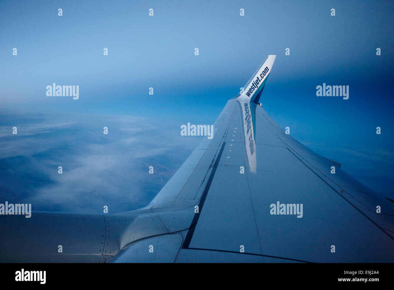 winglet on a boeing 737-800 westjet aircraft flying over Canada. The ...