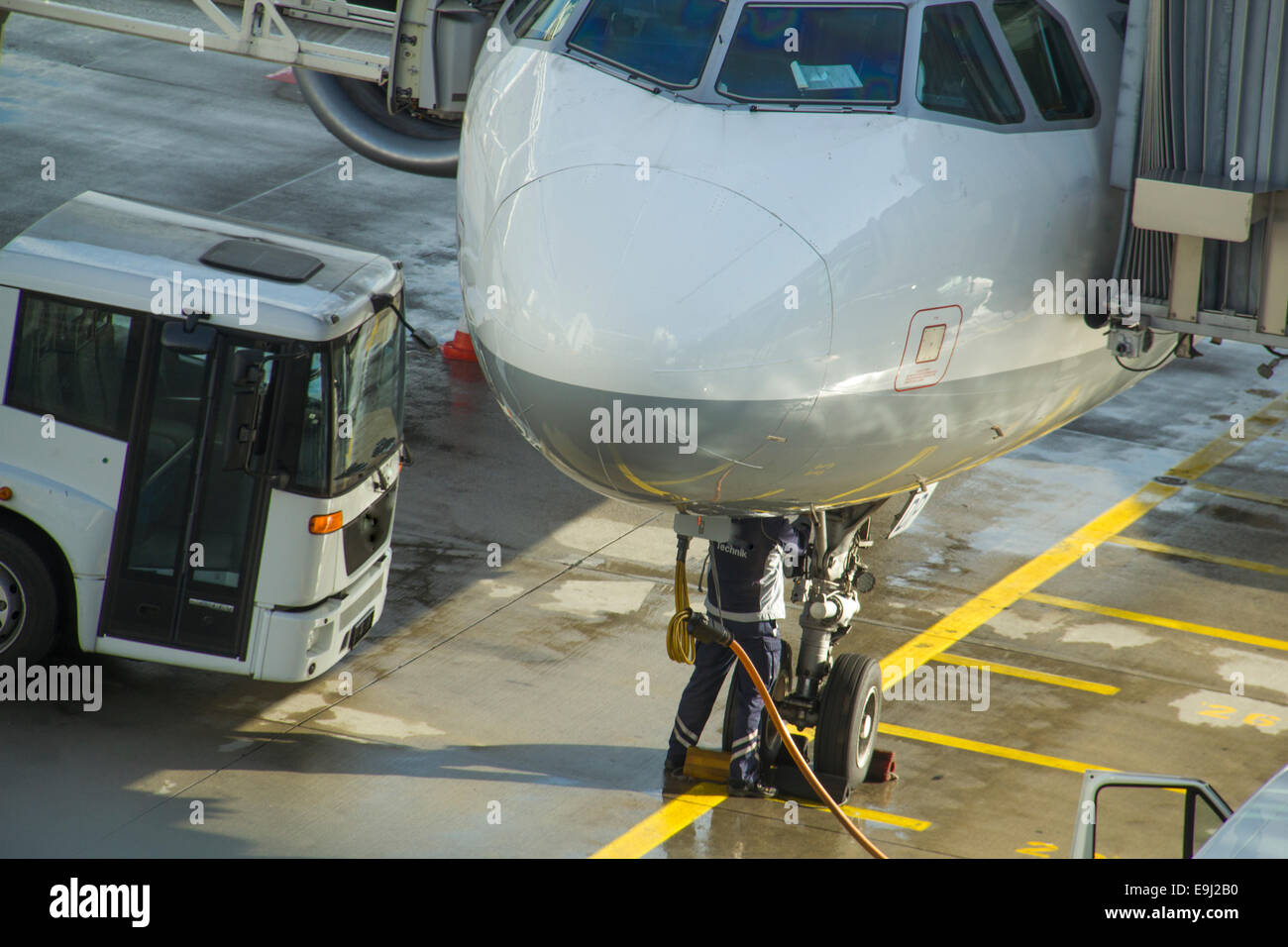 Passenger aircraft maintenance before flight at airport Stock Photo - Alamy