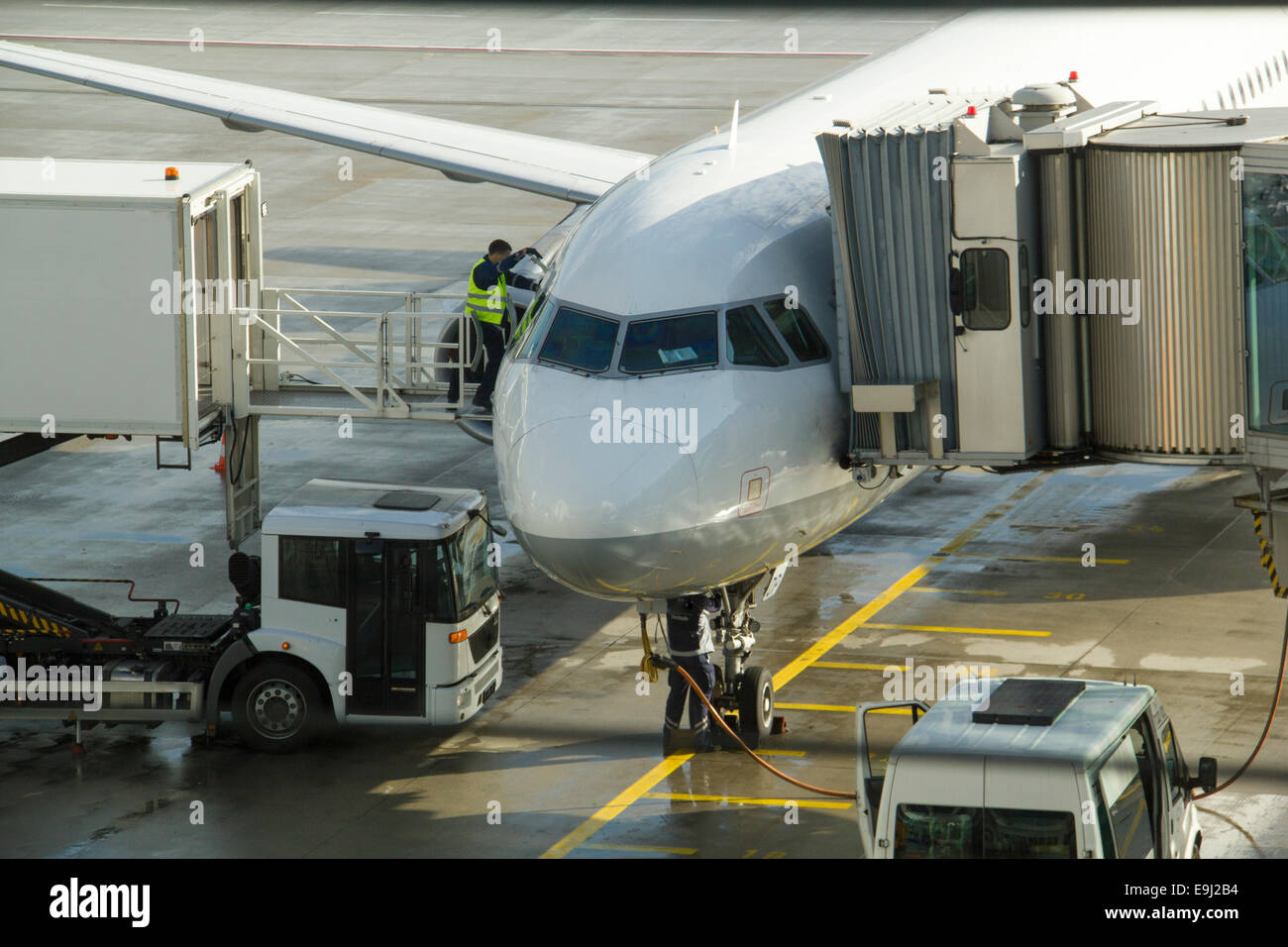 Passenger aircraft maintenance before flight at airport Stock Photo - Alamy