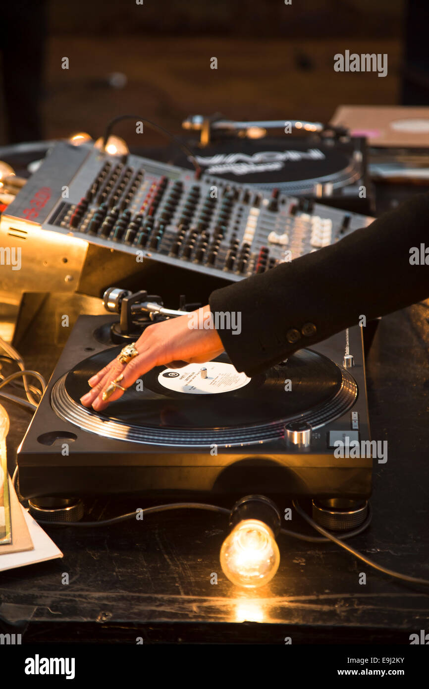 Dj scratching record player and mixing deck at a big party Stock Photo ...