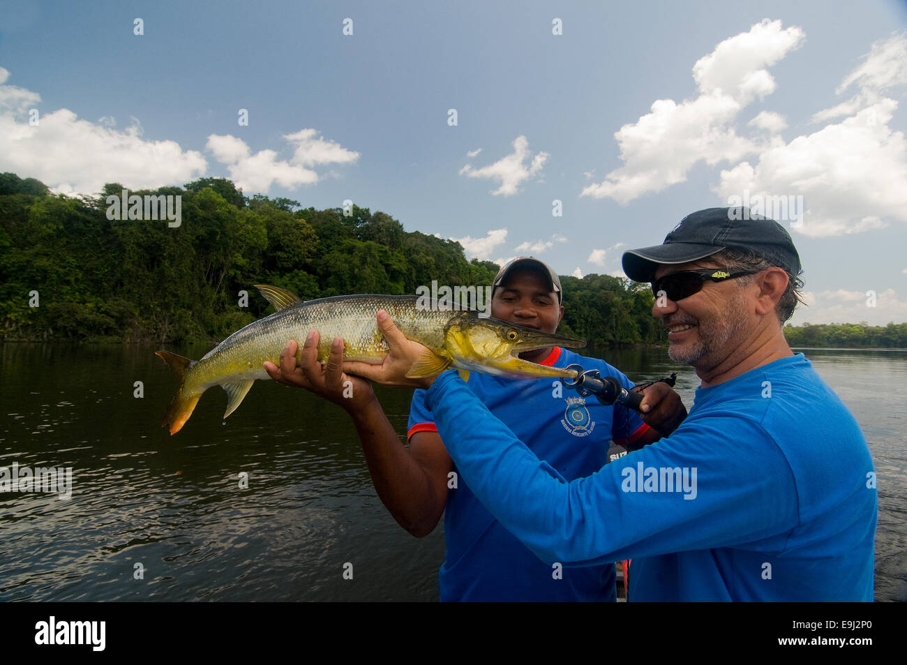 An angler & guide admire a giant bicuda or cachorro caught on a ...