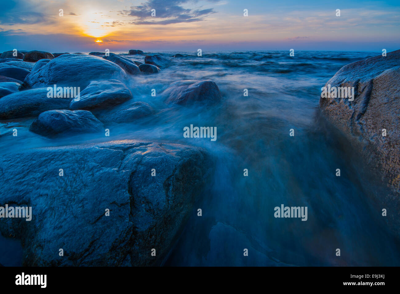 Long exposure shot of coastline sunset Stock Photo - Alamy
