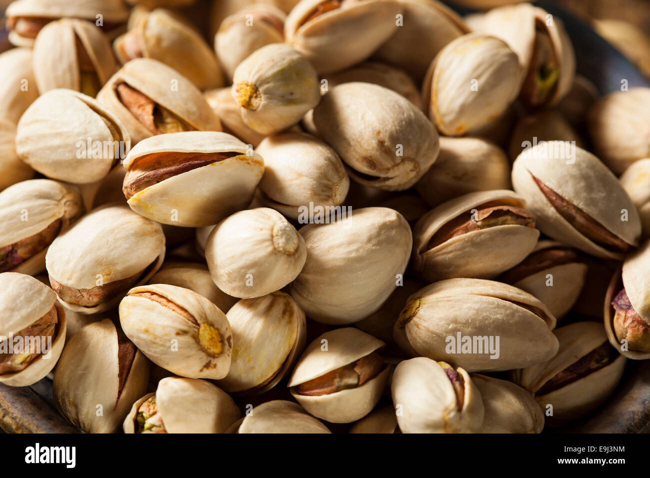 Raw Organic Pistachio Nuts in a Bowl Stock Photo - Alamy