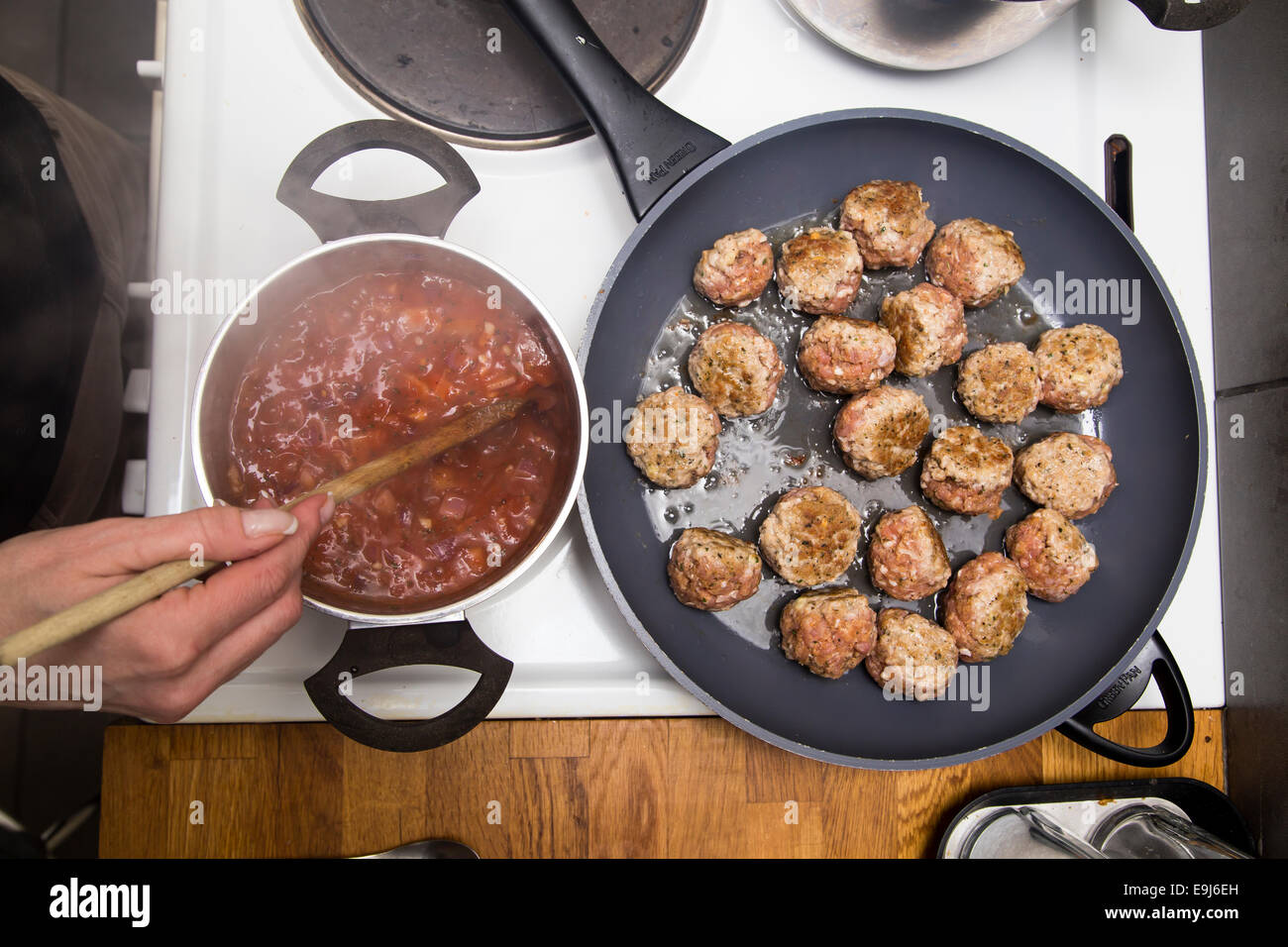 Woman preparing dinner in a home kitchen, real life situation Stock ...