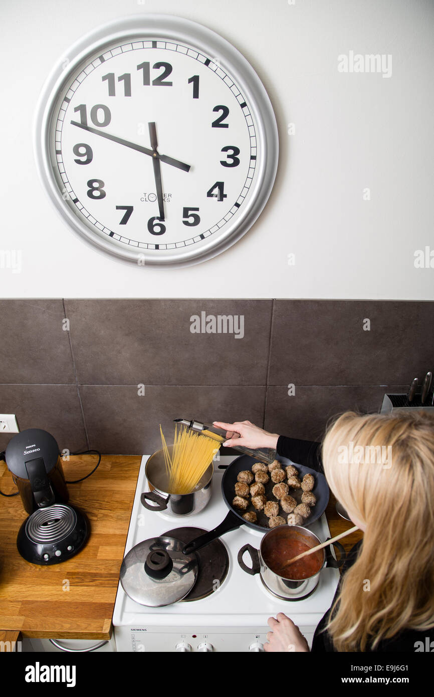 Woman cooking dinner at home Stock Photo - Alamy