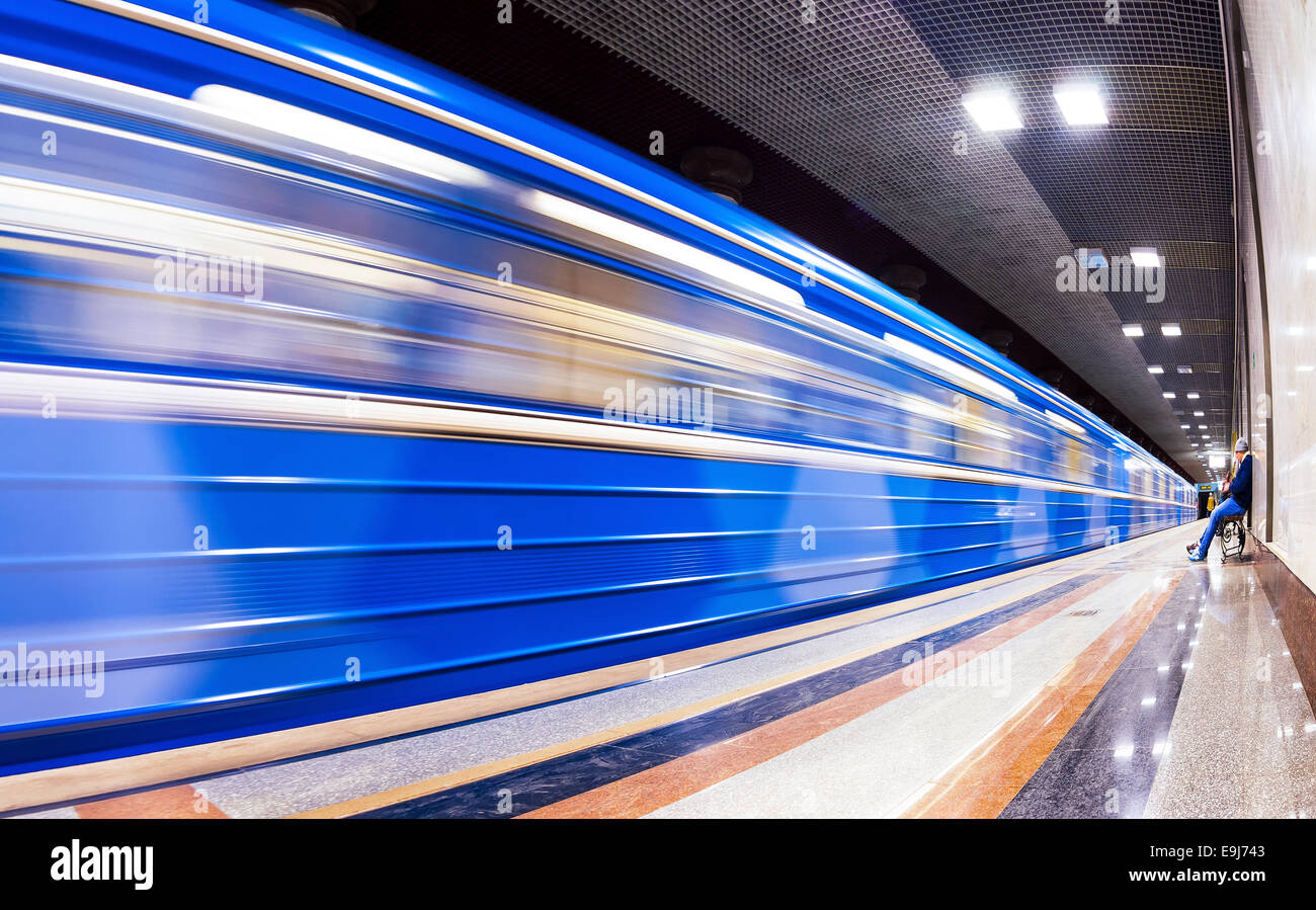 Passengers await the arrival of the train at subway station Stock Photo ...