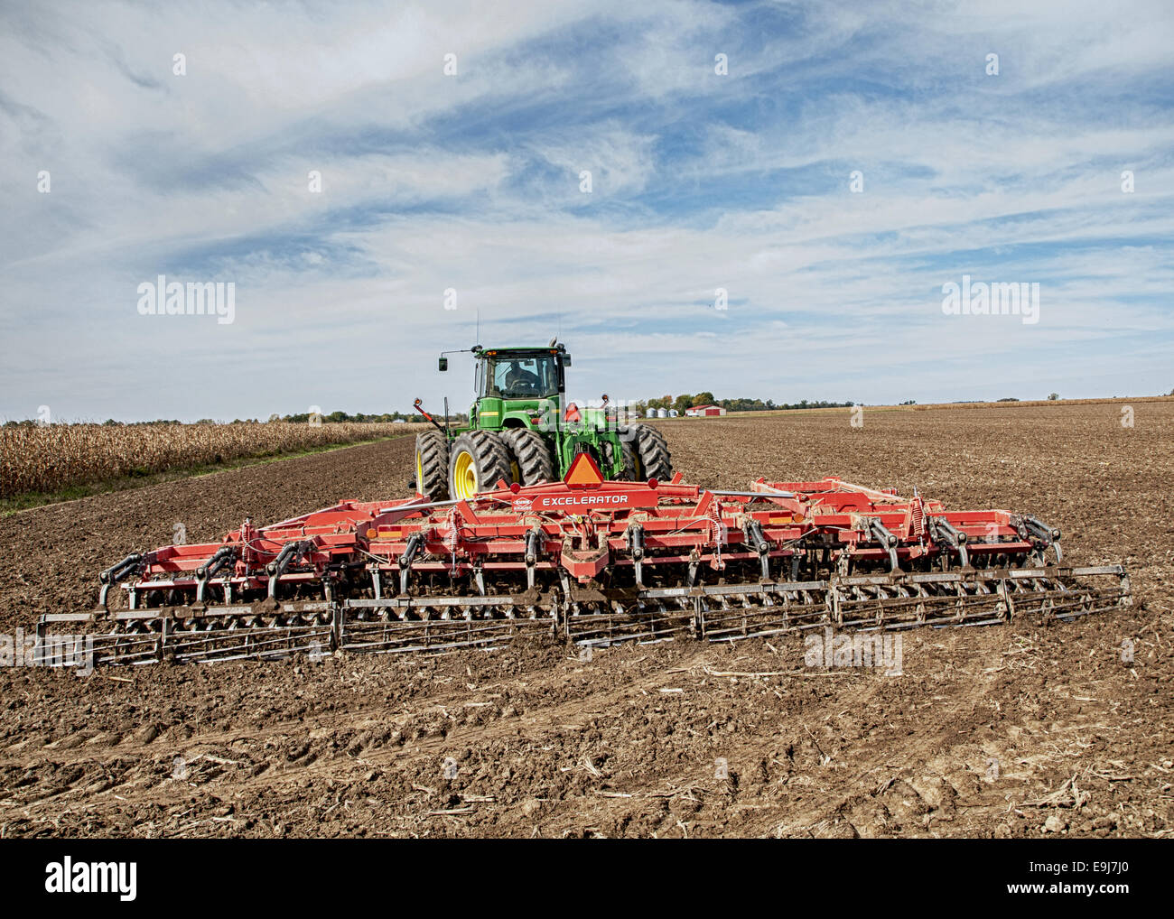 John Deere 9330 tractor disking a field. View is from the rear Stock ...