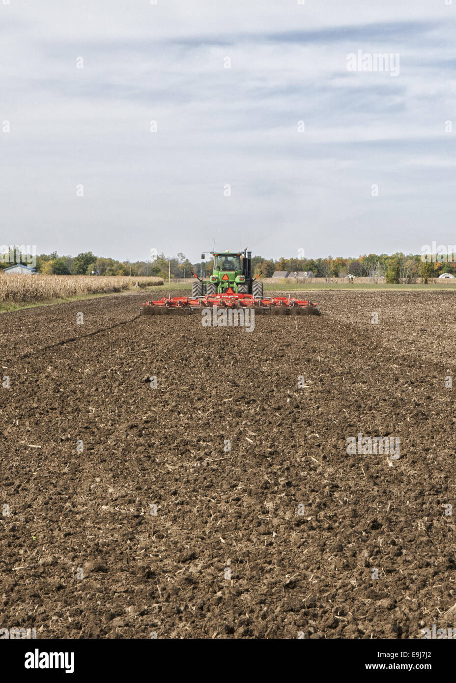 John Deere 9330 tractor pulling a Excelerator disk, disking a field ...