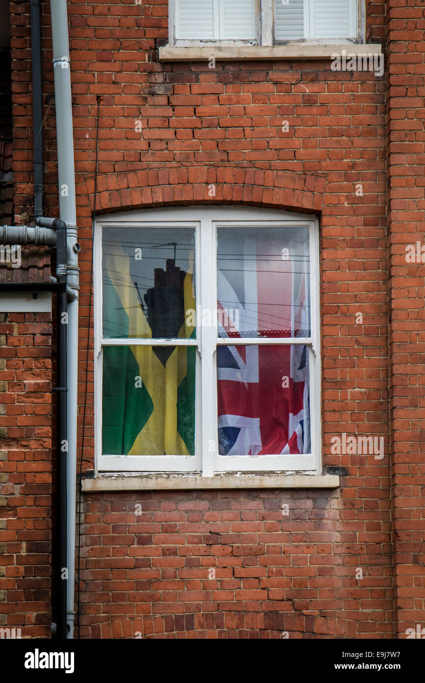 window with Jamaican and British flag Stock Photo - Alamy