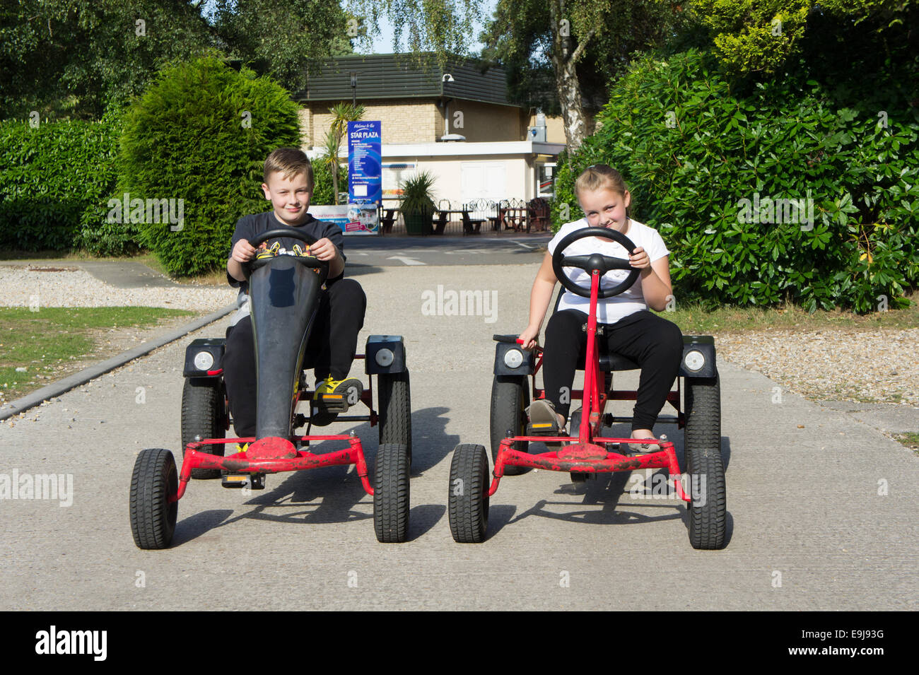 Two children riding on go karts at a Sandford Holiday Park, Poole ...