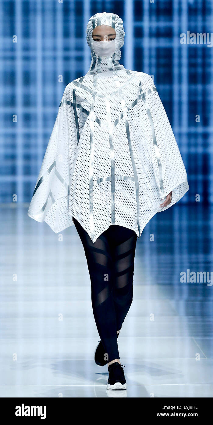 Beijing, China. 28th Oct, 2014. A model presents a creation featuring a ...