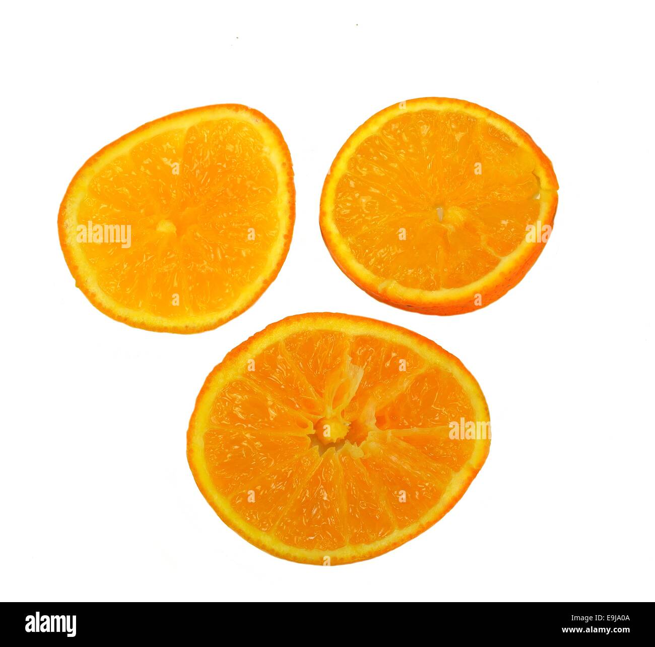 Three orange slices on a white background Stock Photo - Alamy