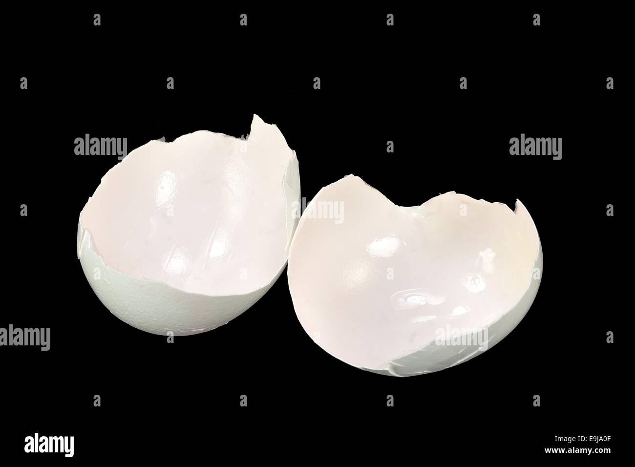 Empty egg shell on a black background Stock Photo - Alamy