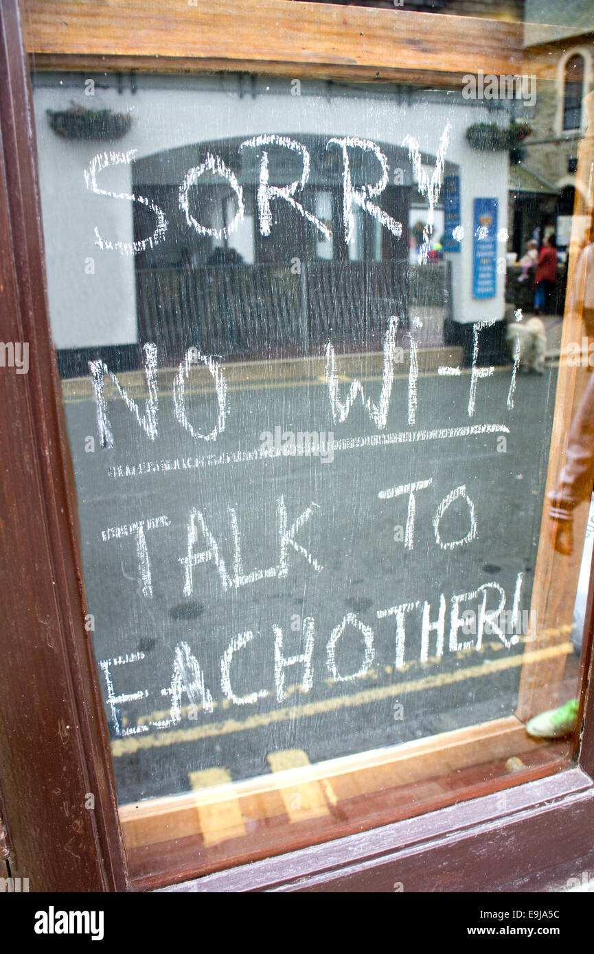 Sign in the window of a restaurant in Looe, Cornwall, Devon, UK saying ...