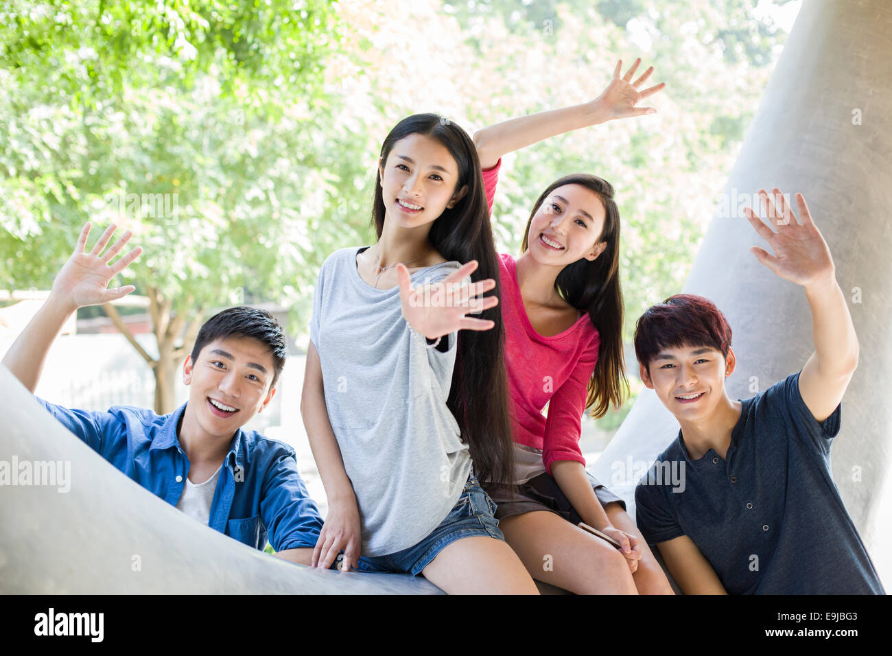 Young adult campus waving hi-res stock photography and images - Alamy