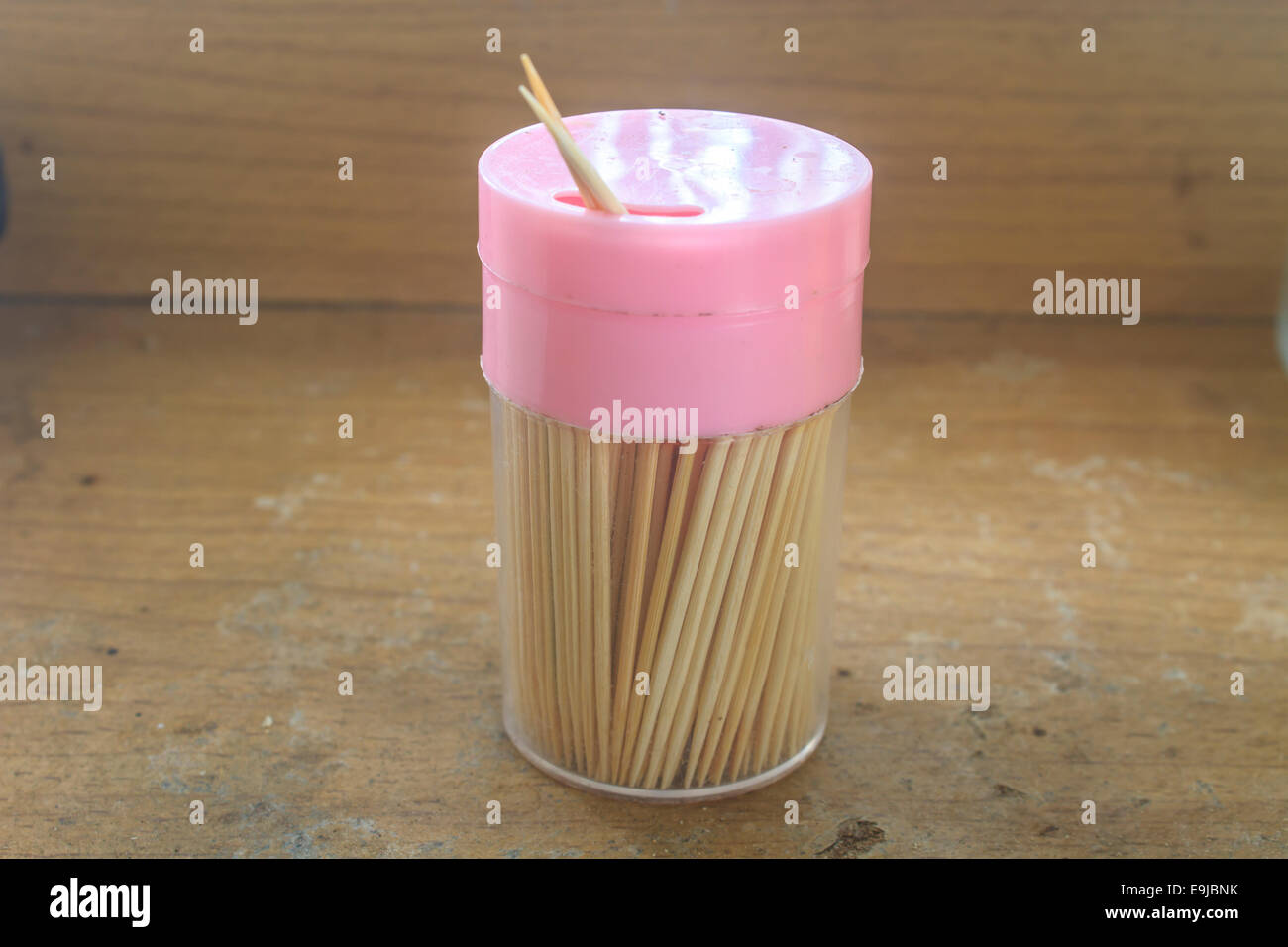 toothpicks in the glass cup with wooden background Stock Photo - Alamy
